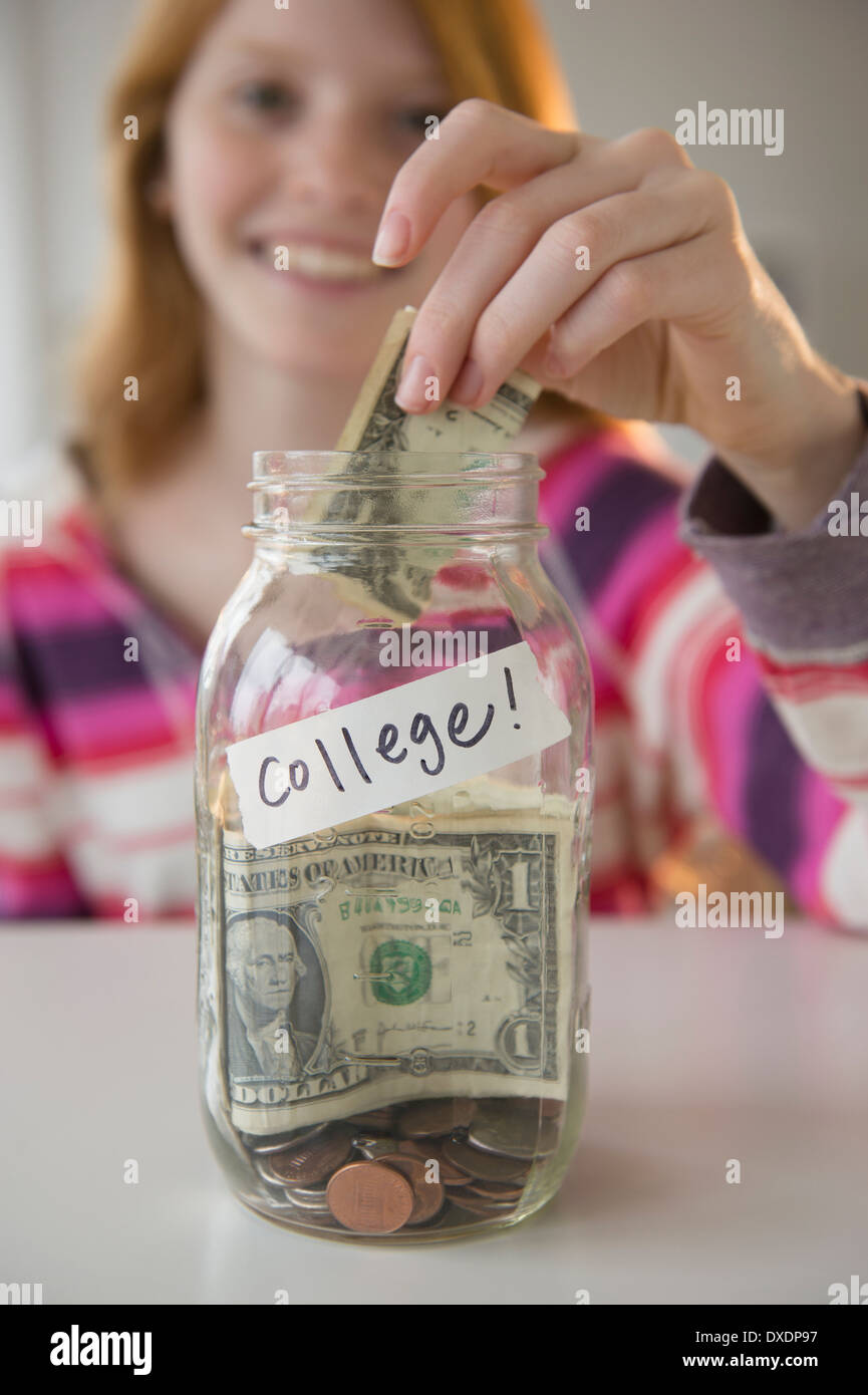 Girl money jar hi-res stock photography and images - Alamy