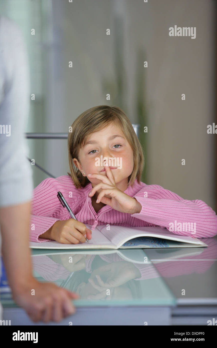 Little girl doing her homework Stock Photo - Alamy
