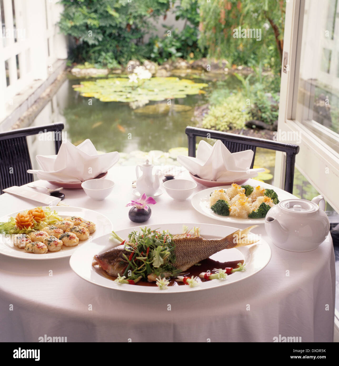 Asian cuisine, Chinese, steamed fish, dim sum, restaurant setting Stock ...