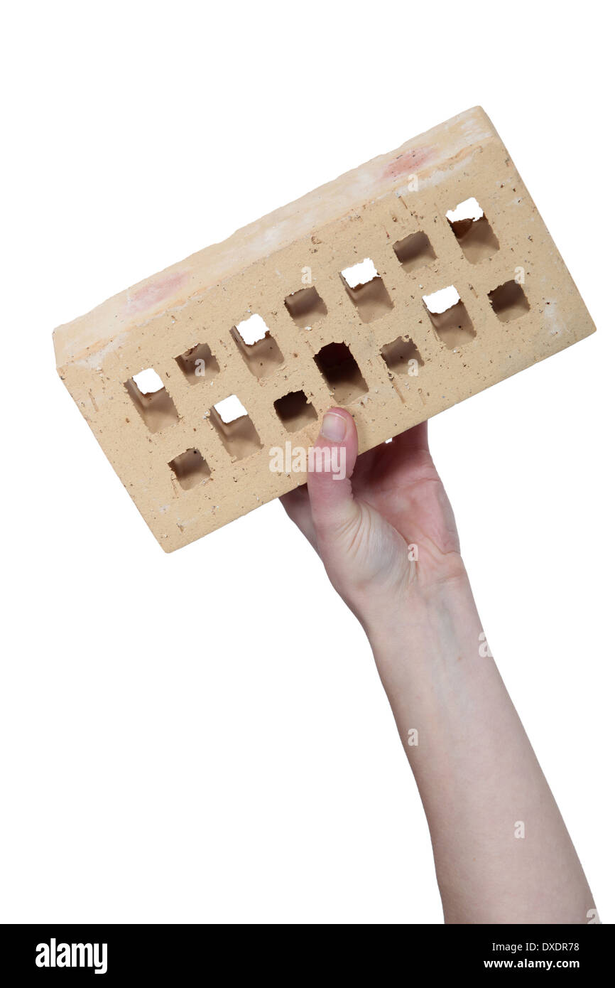 Hand holding a house brick Stock Photo - Alamy