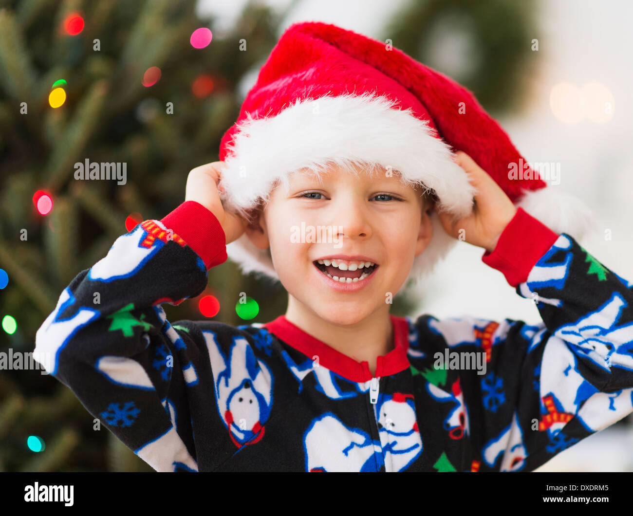 Boy (6-7) wearing santa hat Stock Photo - Alamy