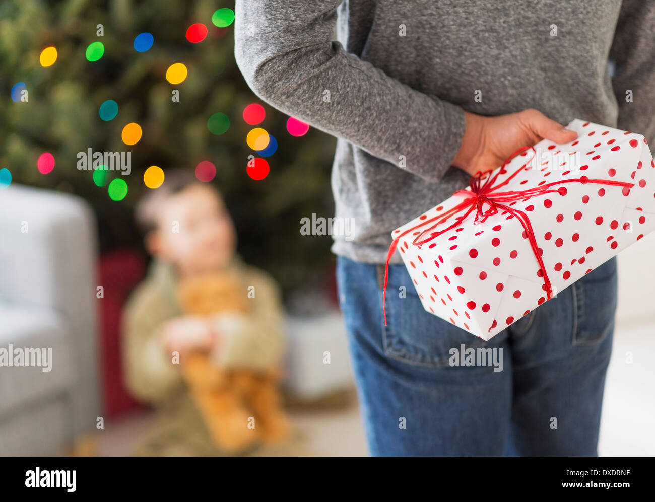 Man holding present Stock Photo - Alamy