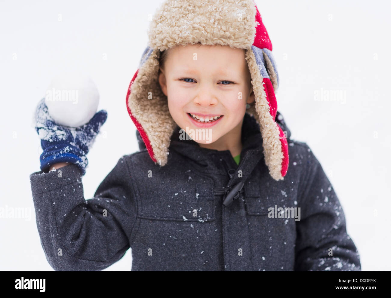 Boy is throwing snowball hi-res stock photography and images - Alamy
