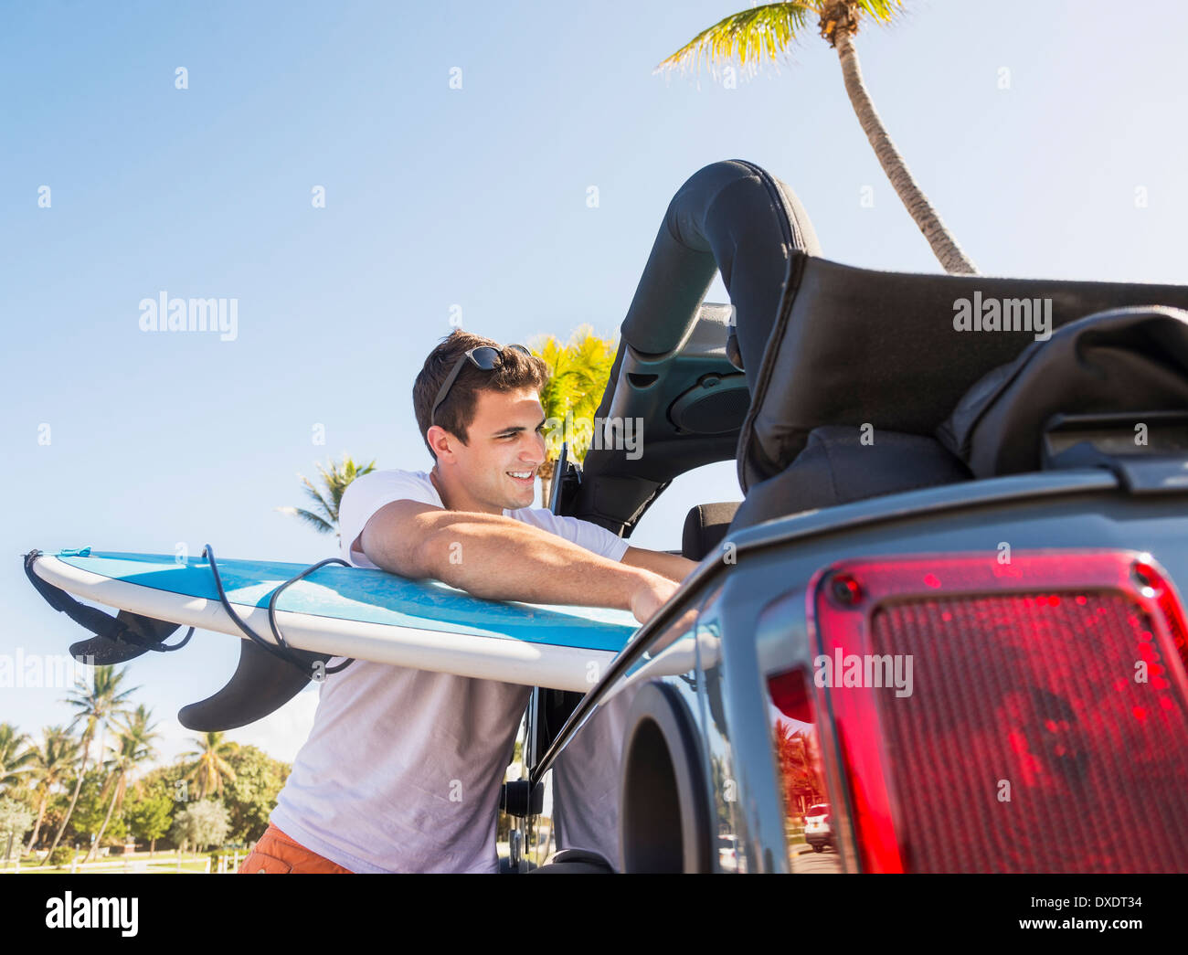 Man with surfboard hi-res stock photography and images - Alamy