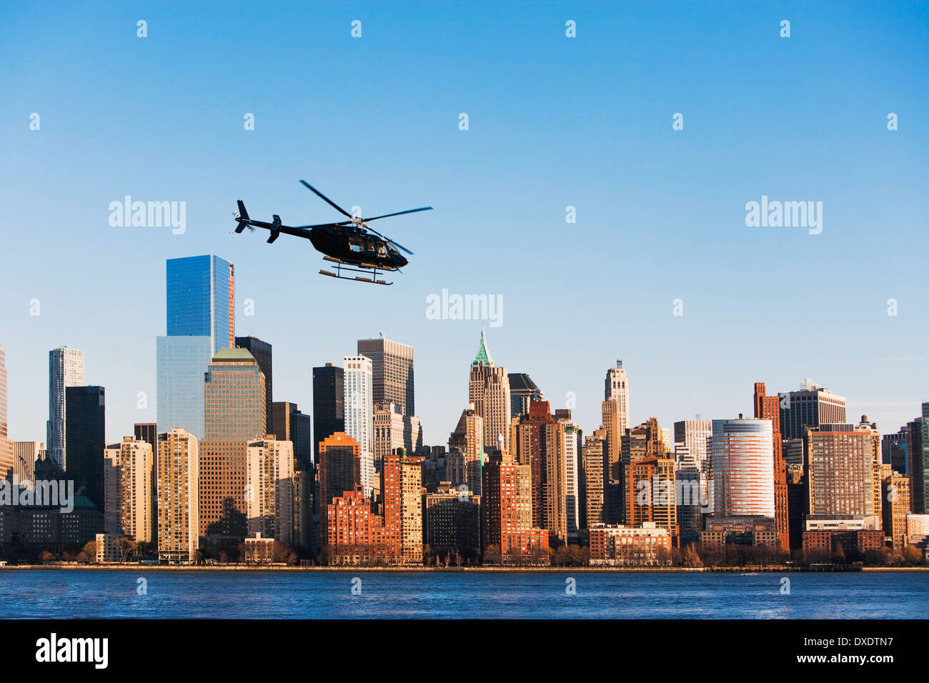 Helicopter flying over city, New York City, New York State, USA Stock ...