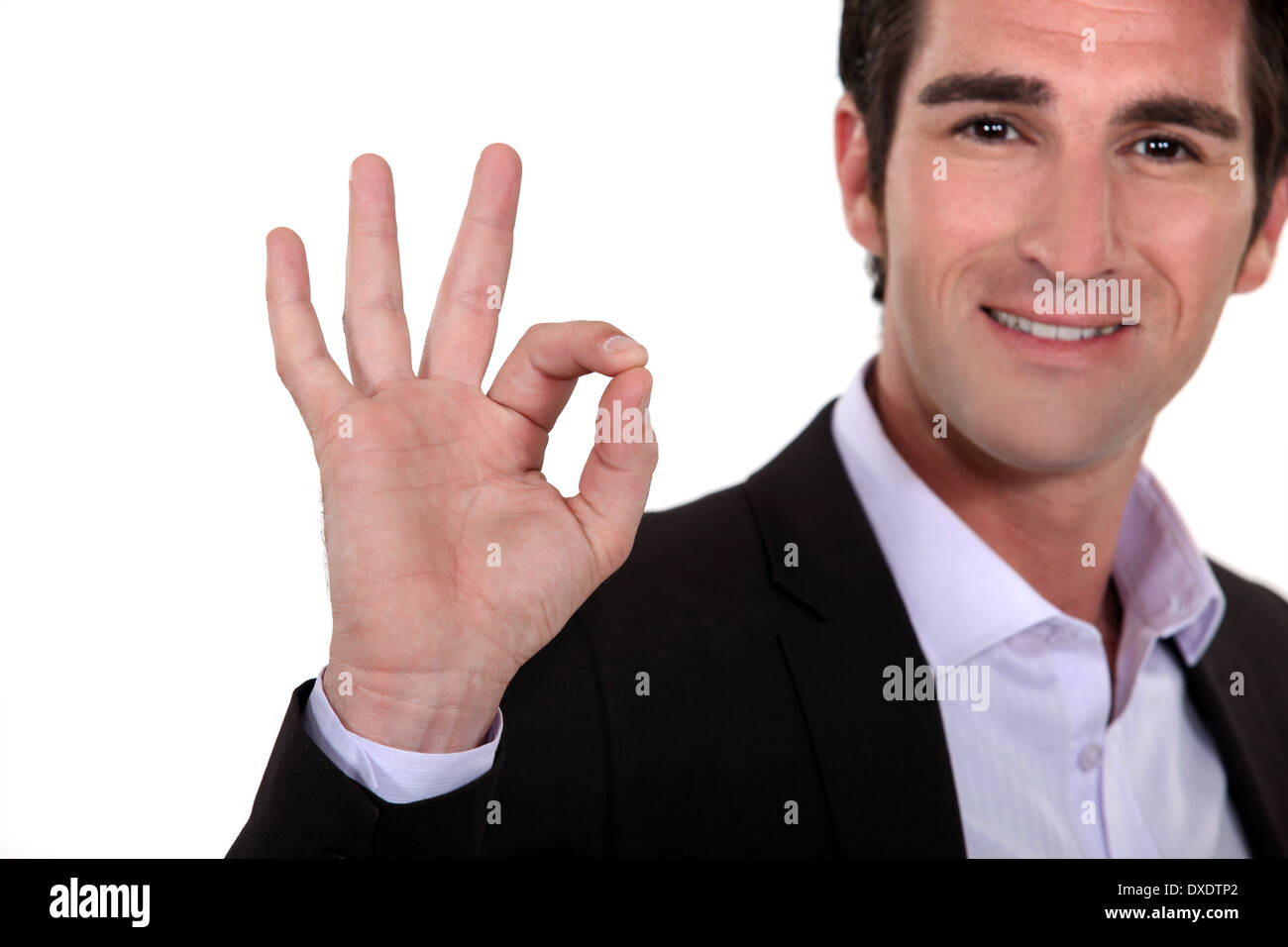 Man giving the a-ok hand gesture Stock Photo - Alamy
