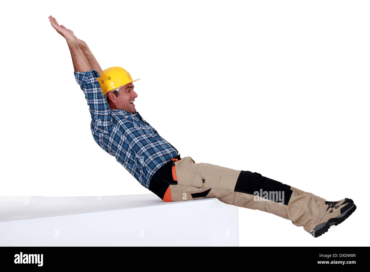 Tradesman stretching his body Stock Photo - Alamy