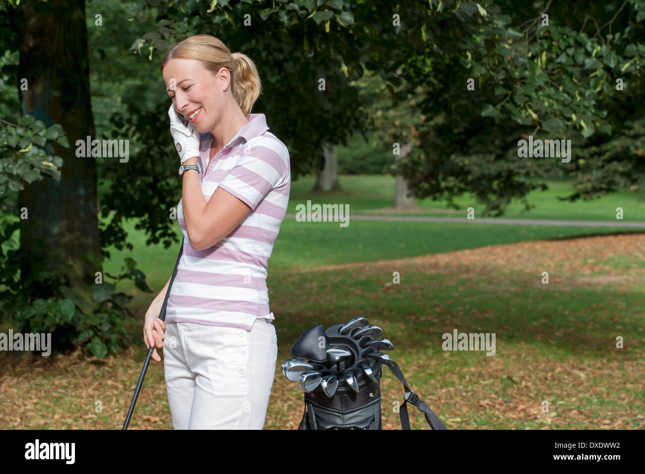 Golfer using cell phone hi-res stock photography and images - Alamy