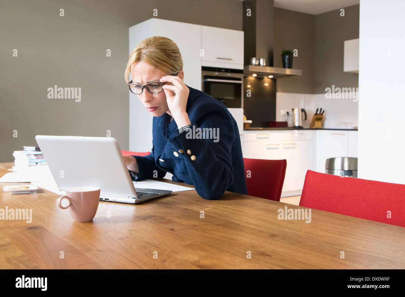 Working at the dining table hi-res stock photography and images - Alamy