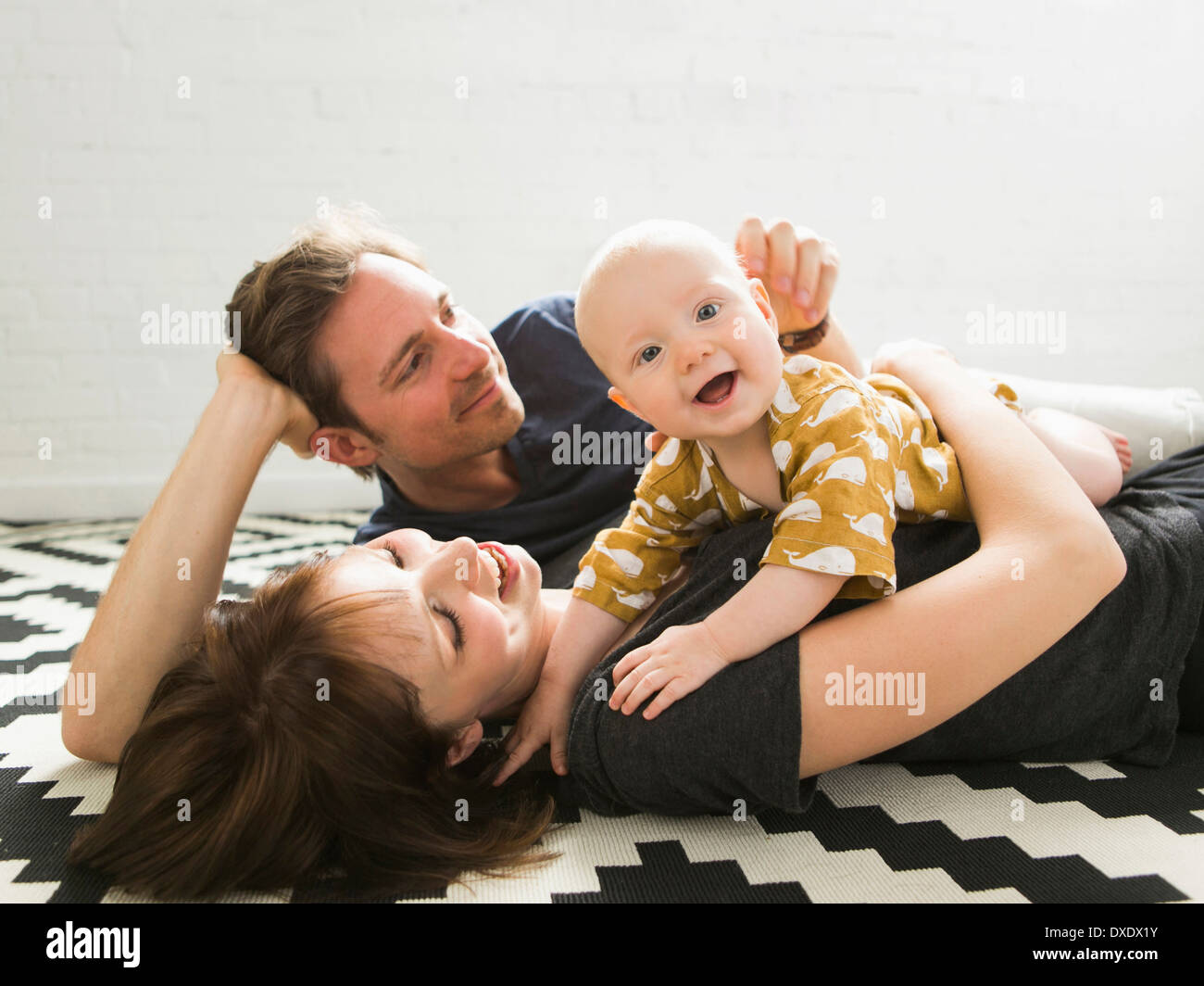 Portrait of parents with baby son (2-5 months Stock Photo - Alamy