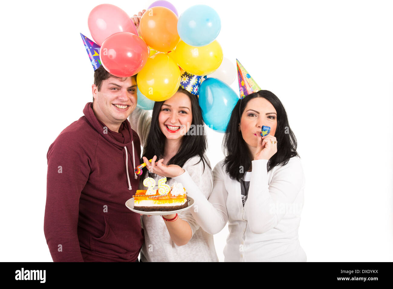 Happy three friends at woman birthday with cake and balloons blow out ...