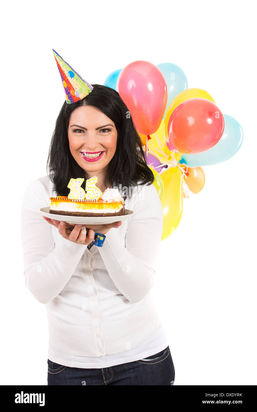 Laughing woman holding birthday cake and balloons isolated on white ...