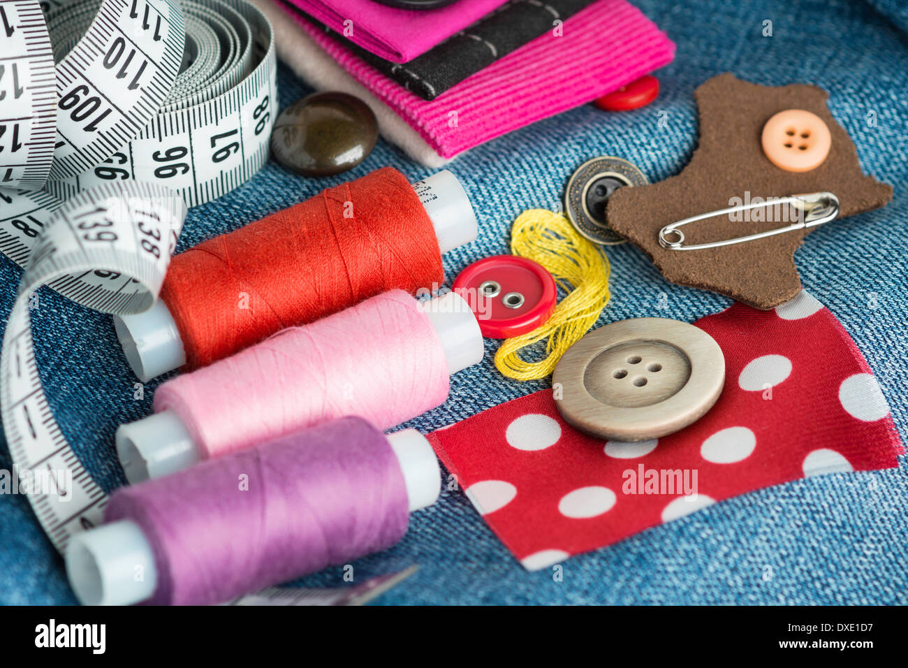 Sewing background with color threads, meter, textile and buttons Stock ...