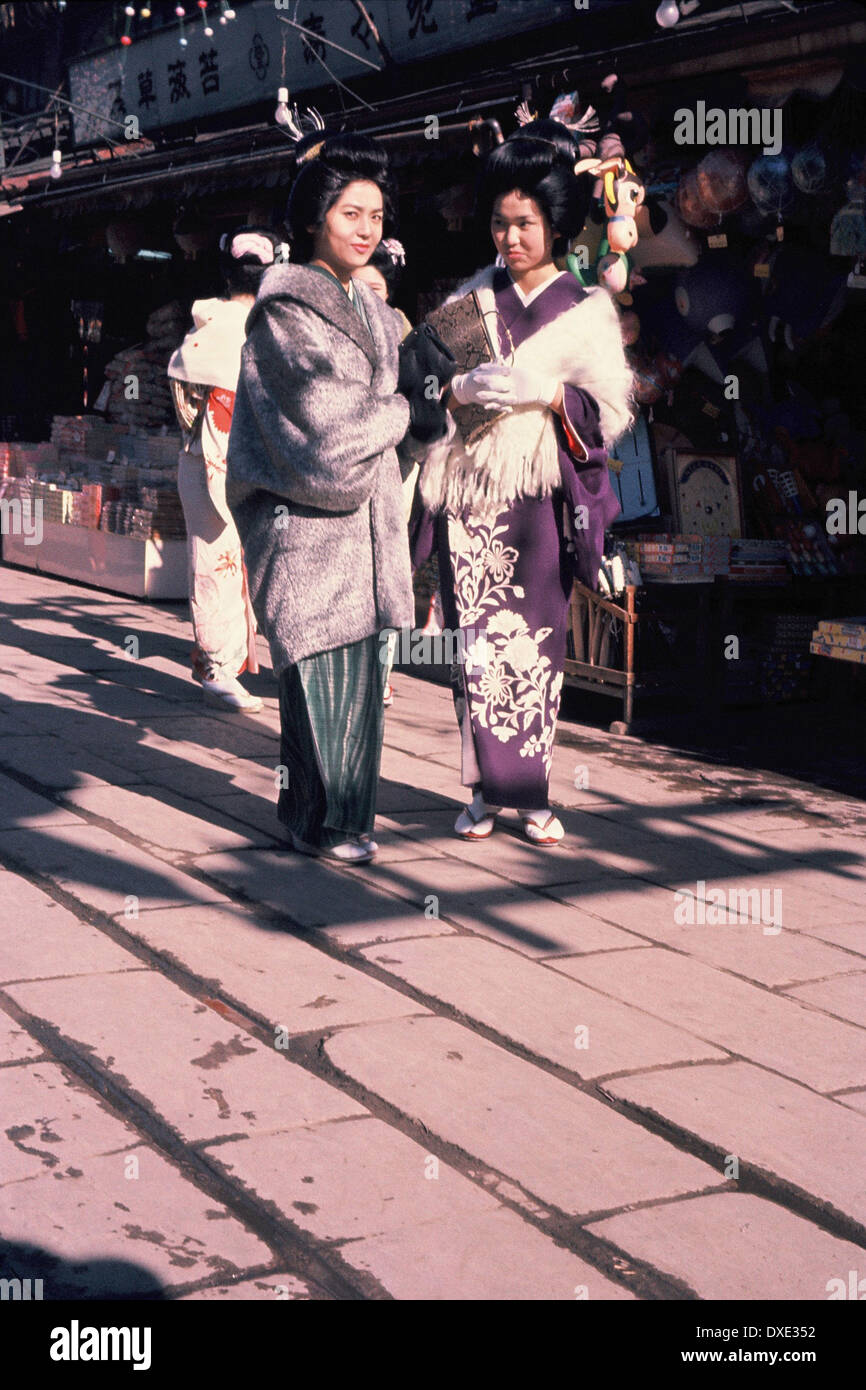 Two geishas shopping in a street market in Tokyo, 1961 Stock Photo - Alamy