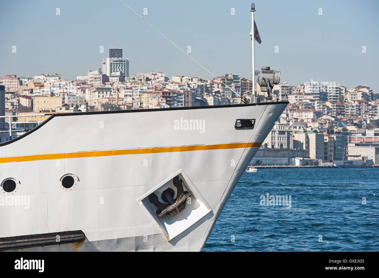 Bow of a large metal ship in port against cityscape background Stock ...