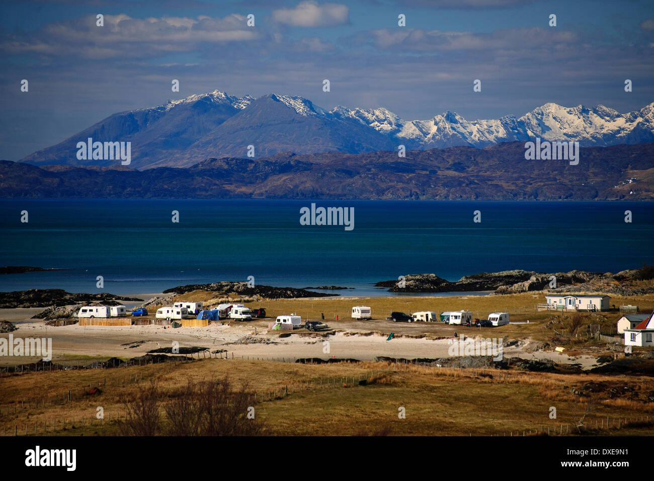 Cravan and camping site sands of Morar with the isle of Skye hills ...
