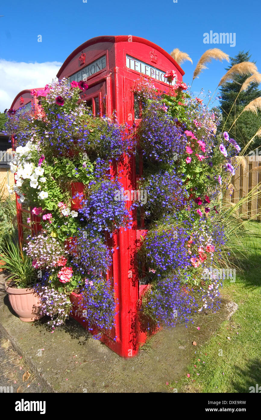 Old Red Telephone Box with Flowers Stock Photo - Alamy