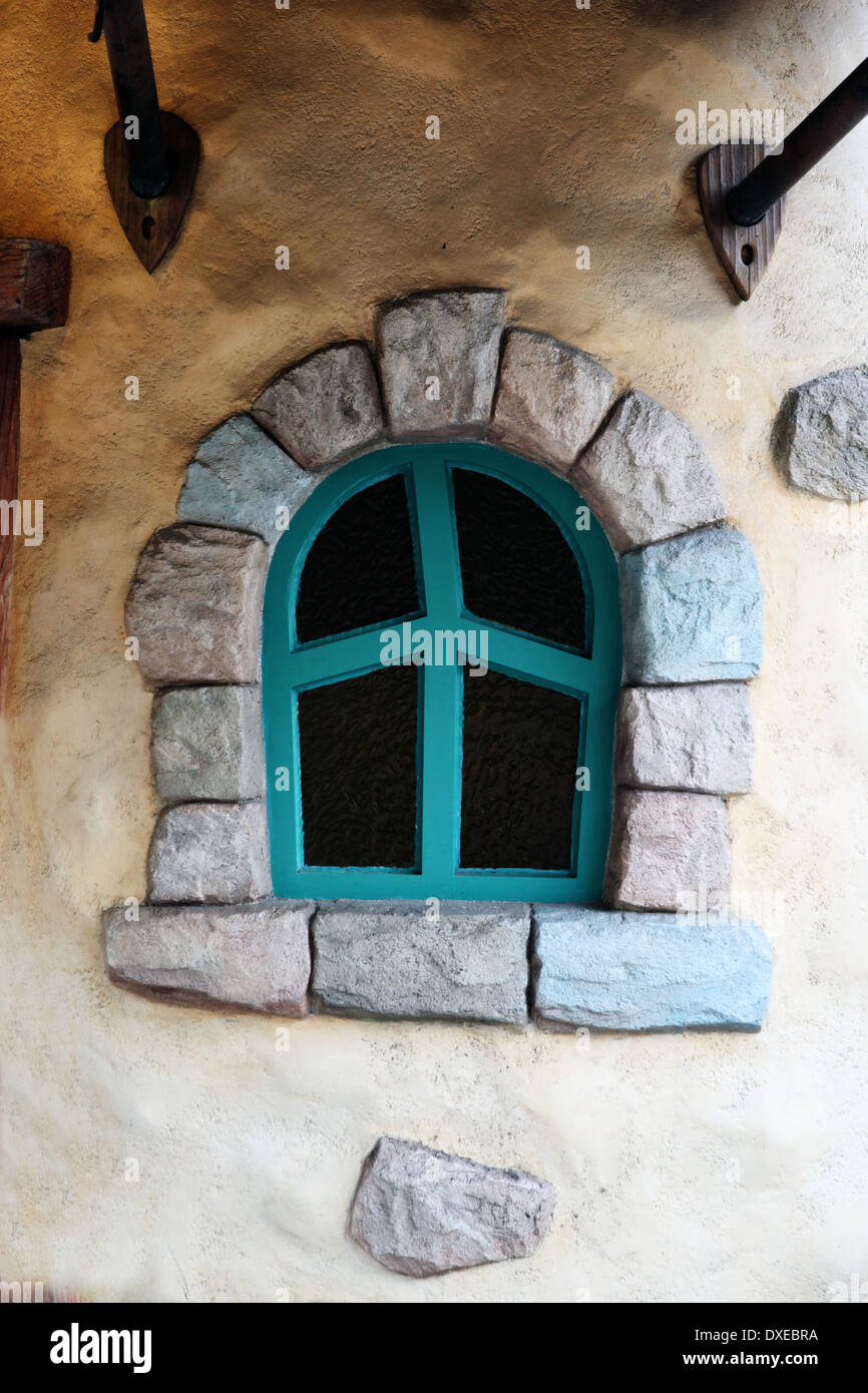 It's a photo of a window in the middle of a wall, We can see the frame ...