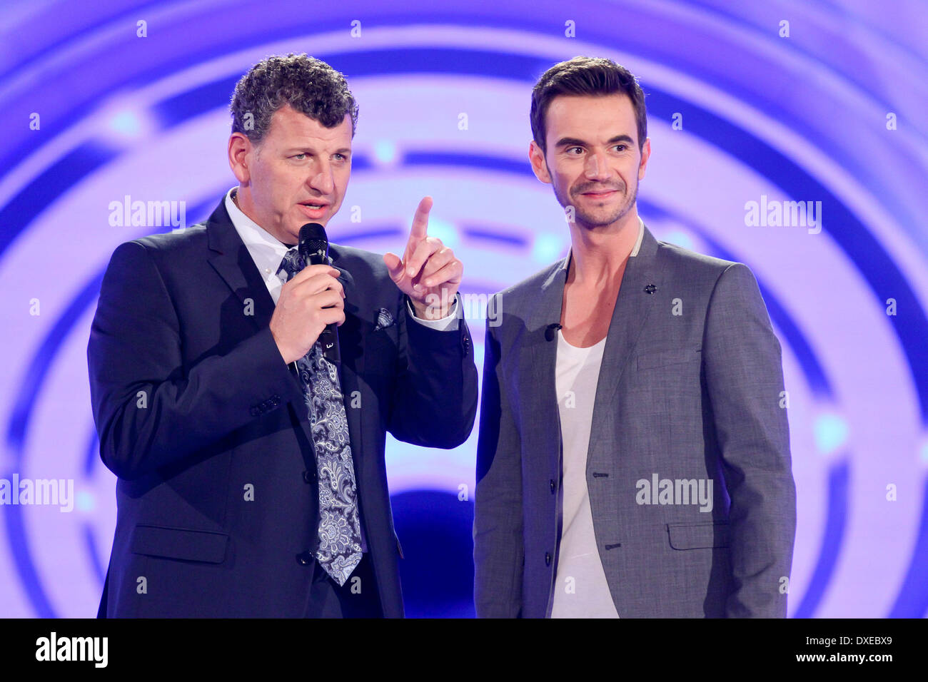 German television presenter Florian Silbereisen (R) stands on stage ...