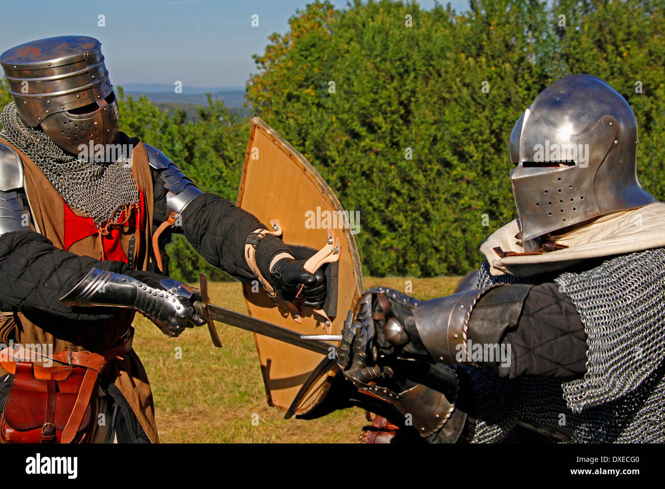knightly sword fighting, medieval camp on the meadows in front of ...