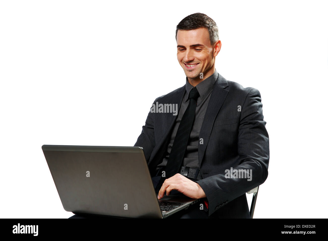 Happy businessman using laptop isolated on a white background Stock ...