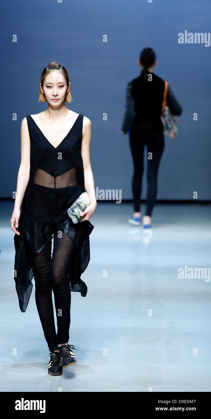 Seoul, South Korea. 24th March 2014. A model presents a creation during ...