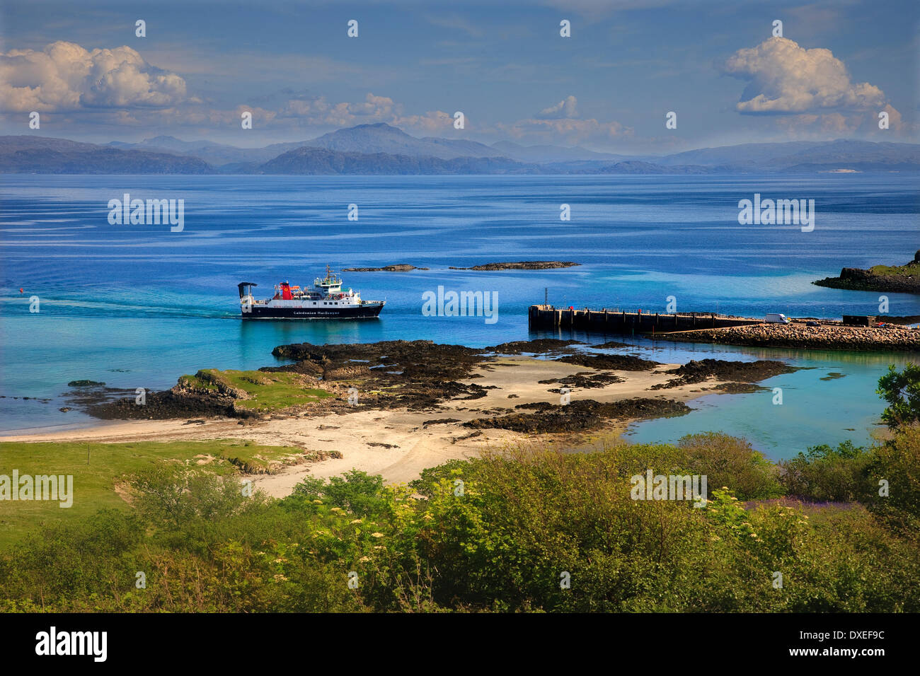 MV Loch Nevis arrives at the Isle of Eigg, Inner Hebrides Stock Photo ...