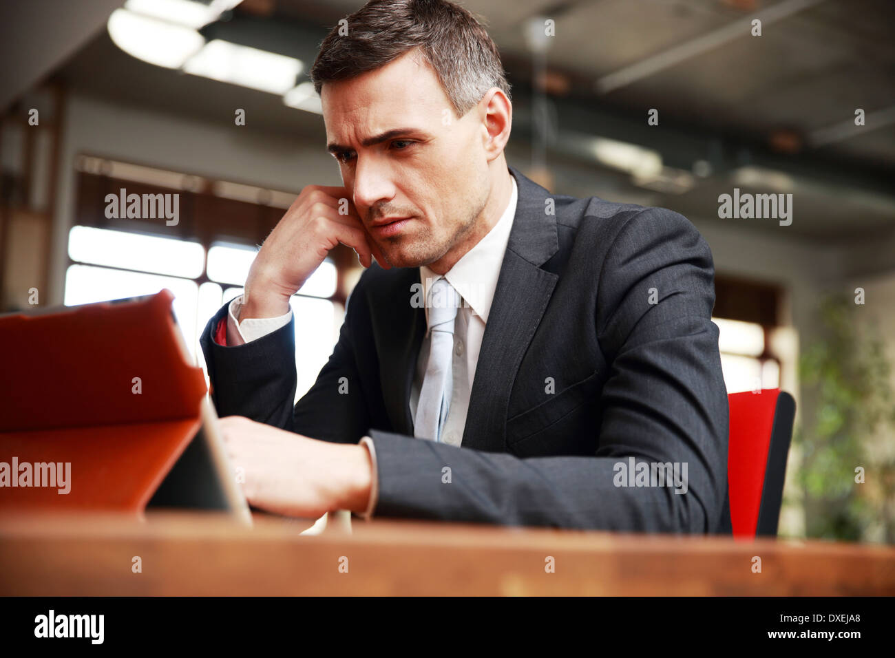 Portrait serious boss sitting table hi-res stock photography and images ...