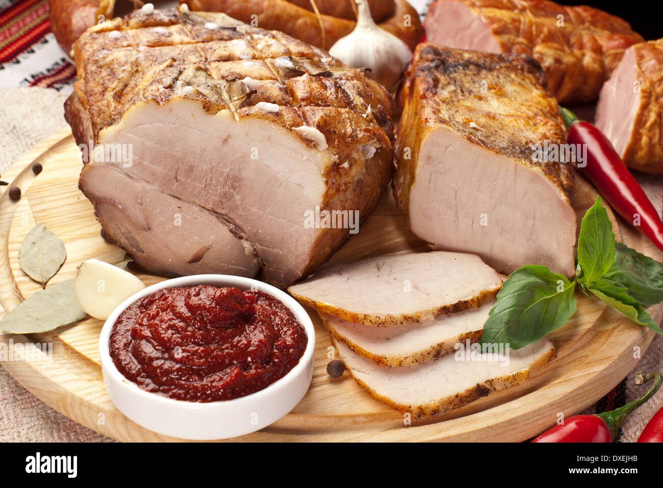 Different types of home-made pork arranged with sauce and vegetables ...