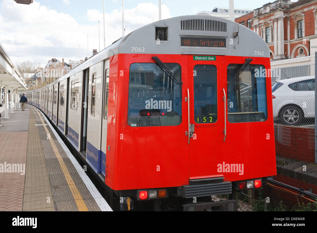 District Line underground train at Kensington Olympia station Stock ...