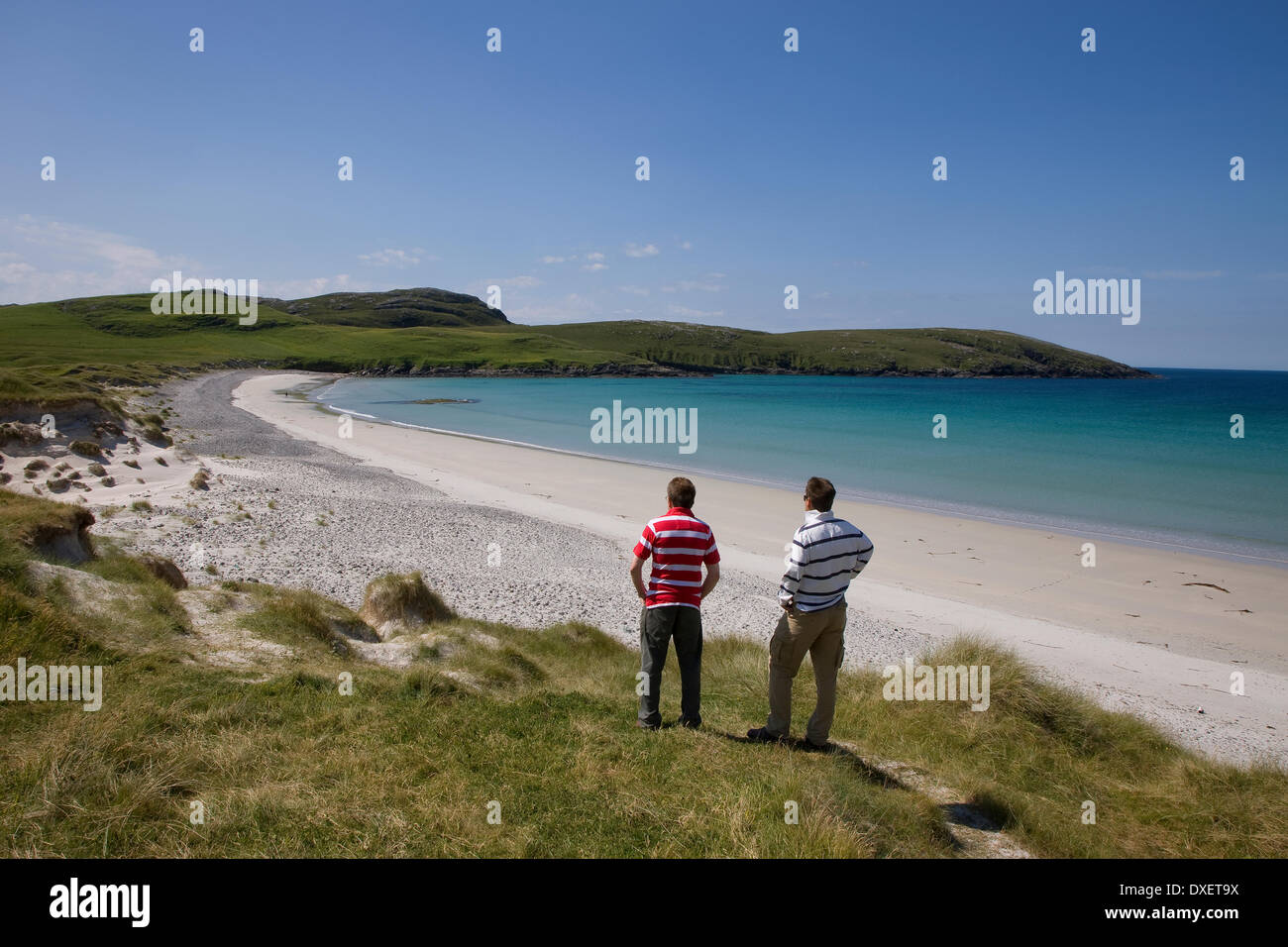 Tourists admire the beaches on Vatersay, Outer Hebrides Stock Photo - Alamy