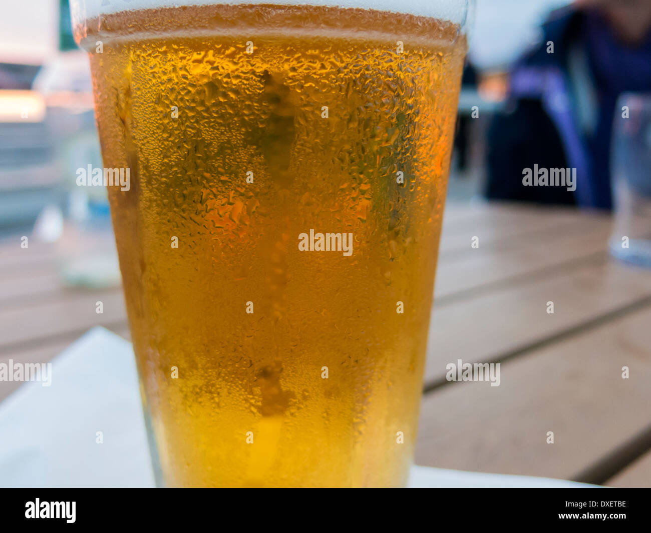 Cold pint glass full of lager on table Cromer England Stock Photo - Alamy