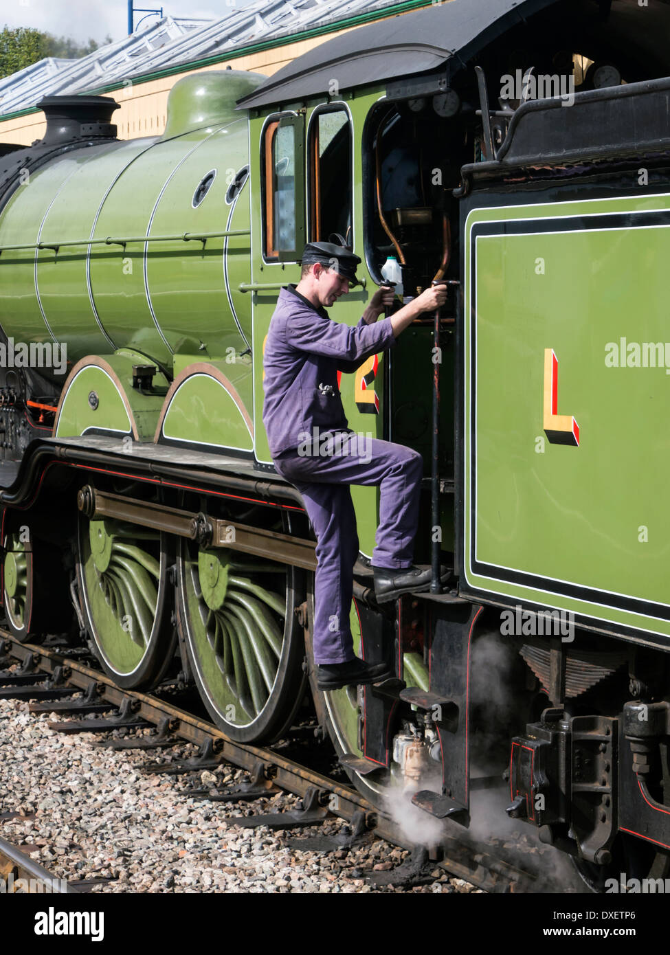 Driver climbing down from steam train Sheringham station and North ...
