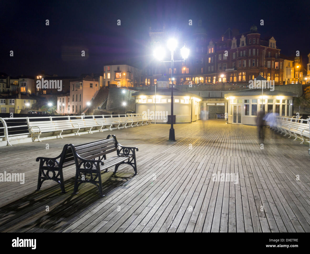 Cromer pier at night with slow shutter speed blurring movement of ...