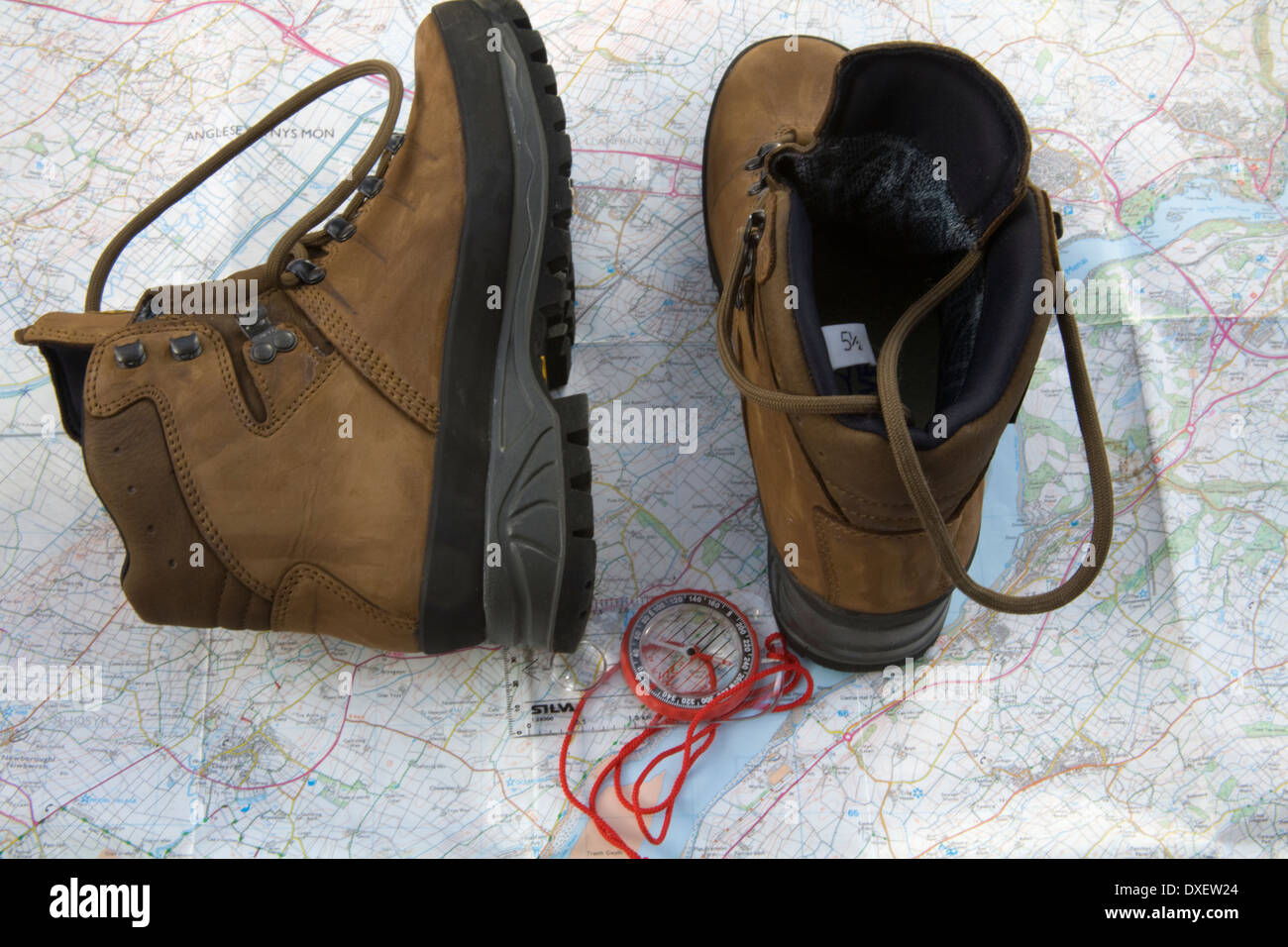 Close up pair new walking boots standing on ordnance survey map with ...