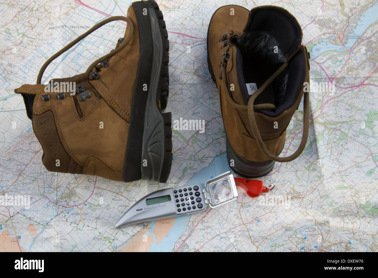 Close up pair new walking boots standing on ordnance survey map with ...