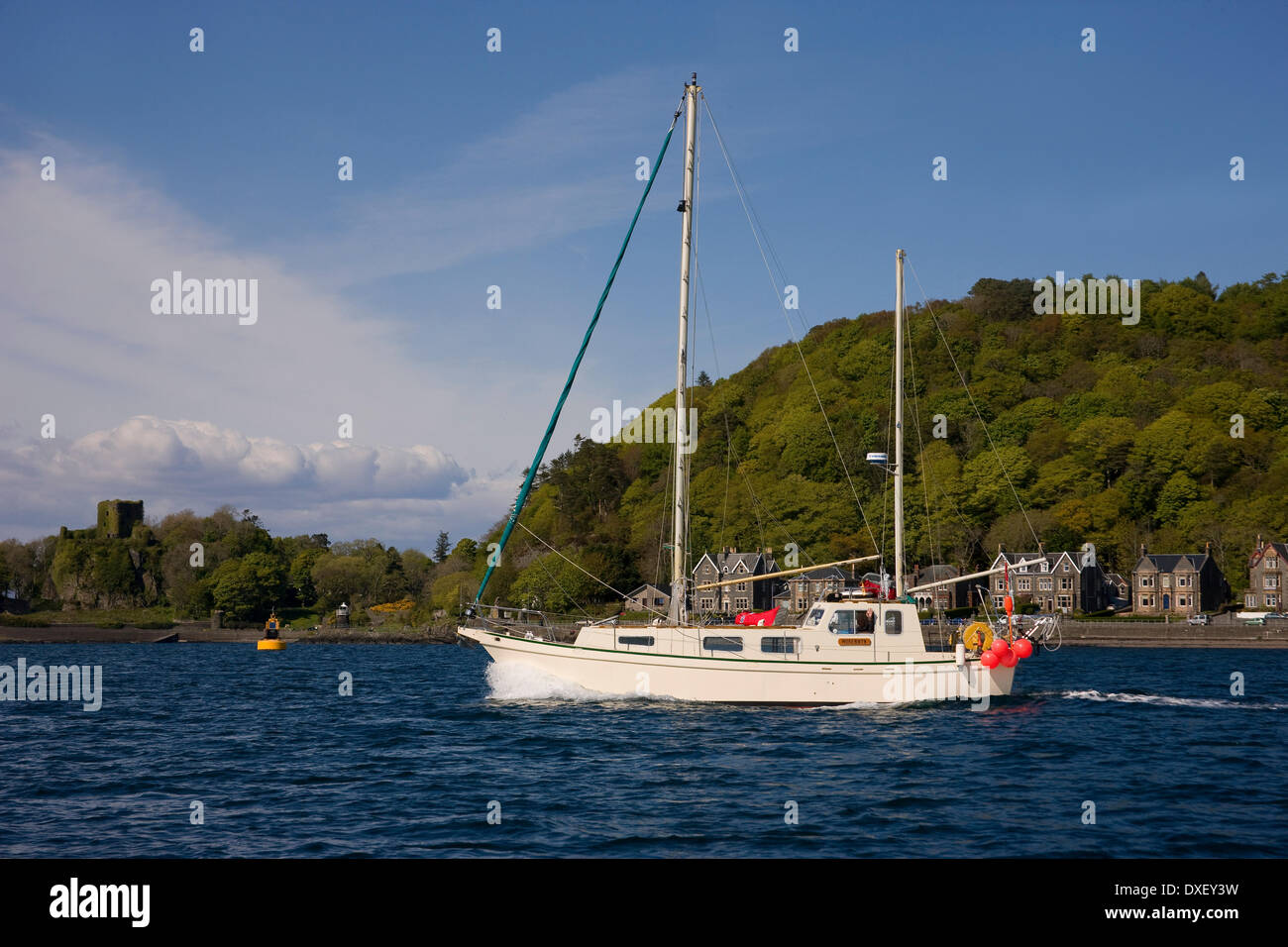 Yacht departs Oban bay with Dunollie Castle in view, Argyll Stock Photo ...