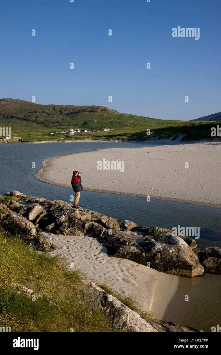 Tourist enjoys the stunning beaches on Barra's West Coast, Isle of ...