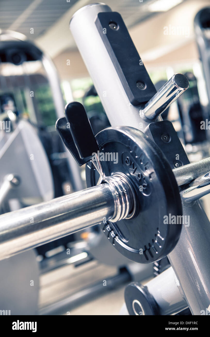 diverse equipment and machines at the gym room Stock Photo - Alamy