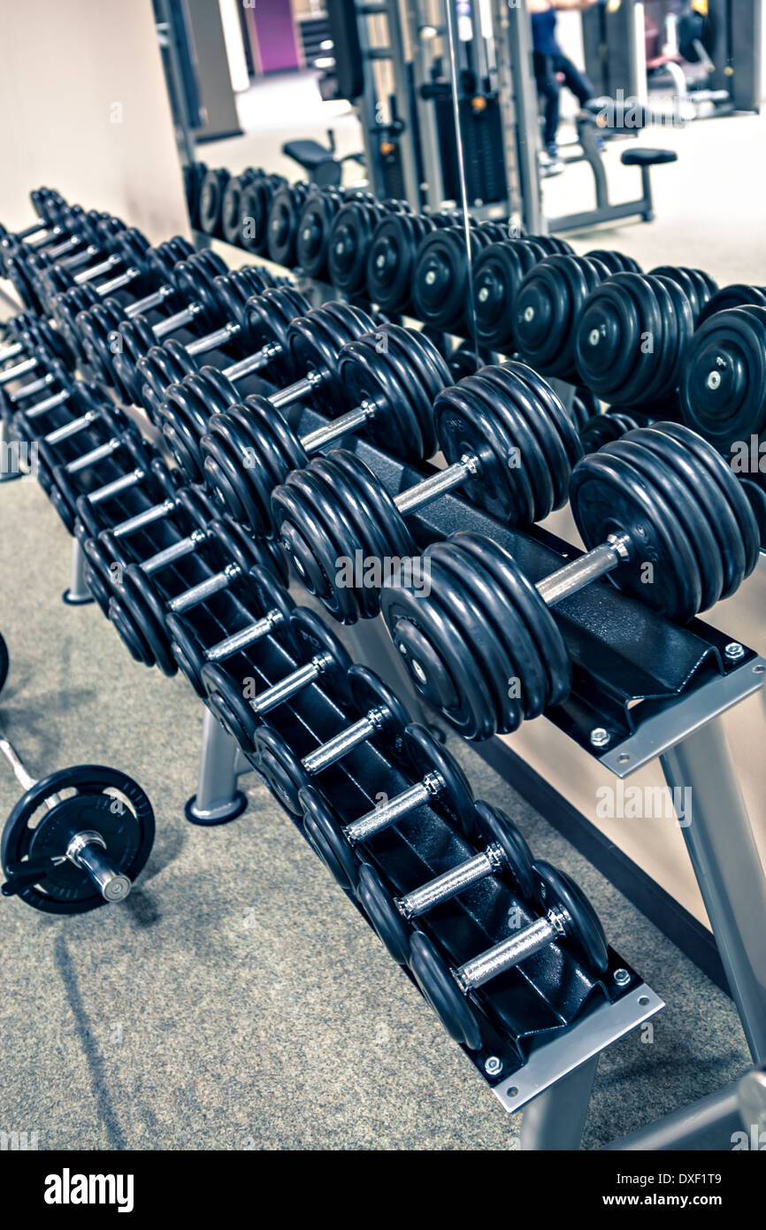 diverse equipment and machines at the gym room Stock Photo - Alamy