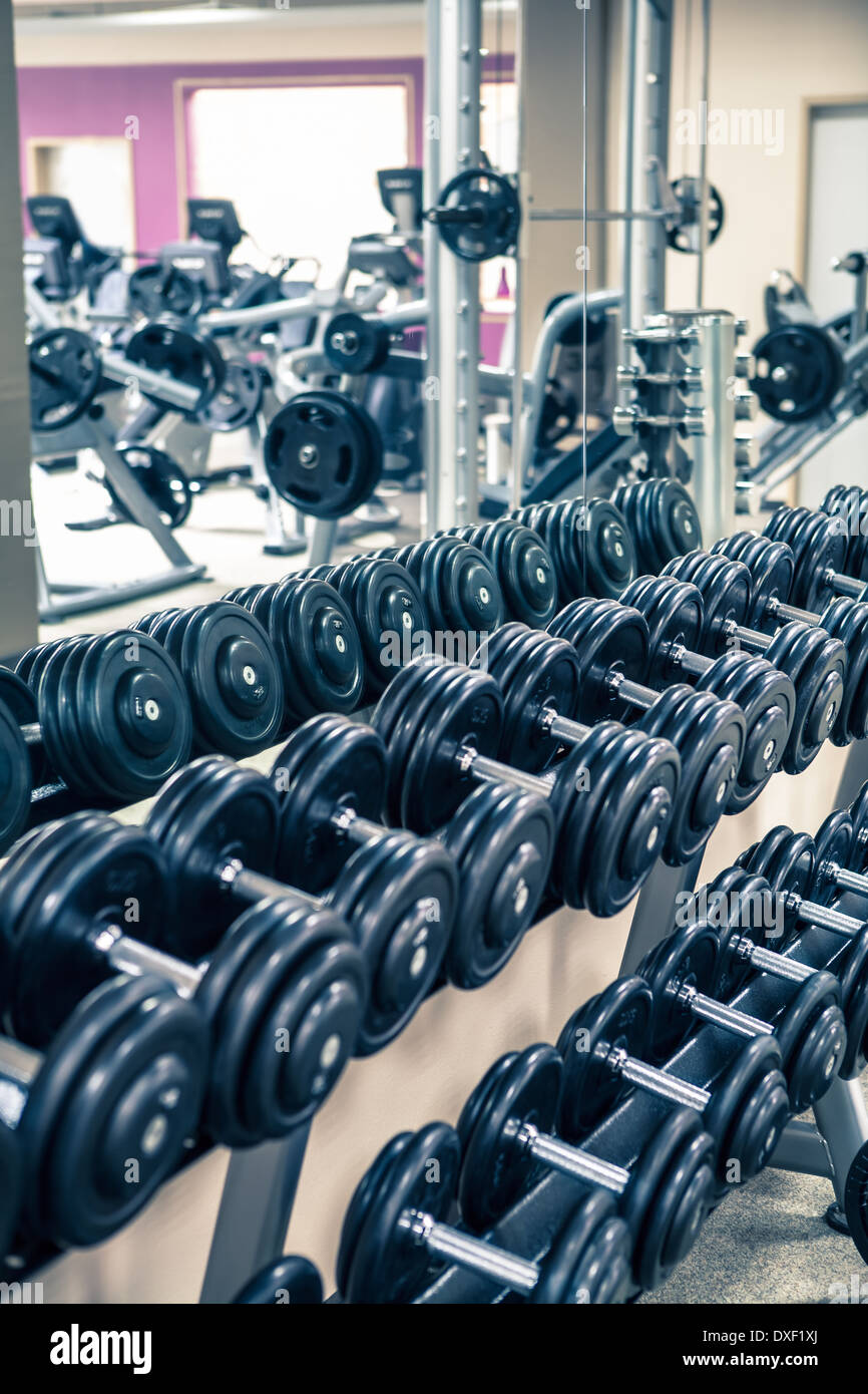 diverse equipment and machines at the gym room Stock Photo - Alamy