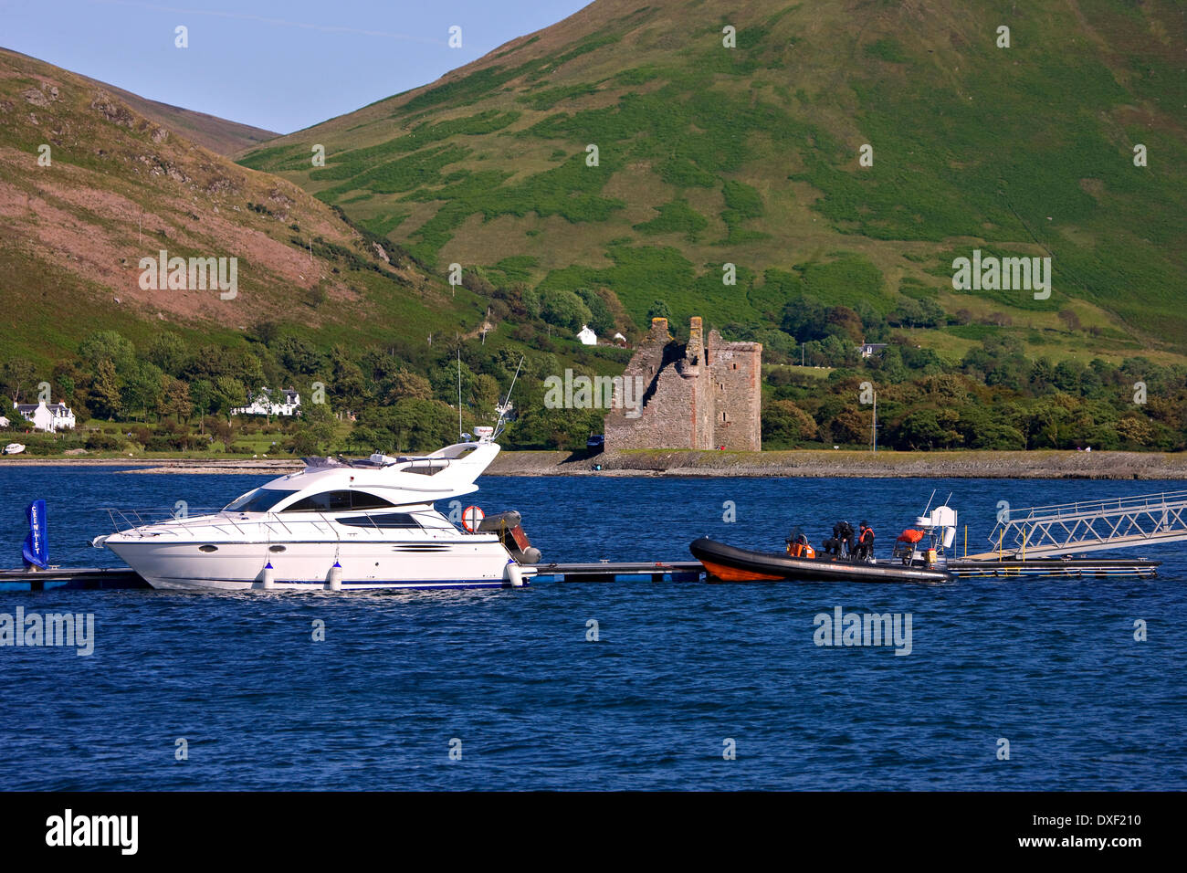 motor cruiser on Loch Ranza near the castle ruins.Arran Stock Photo - Alamy