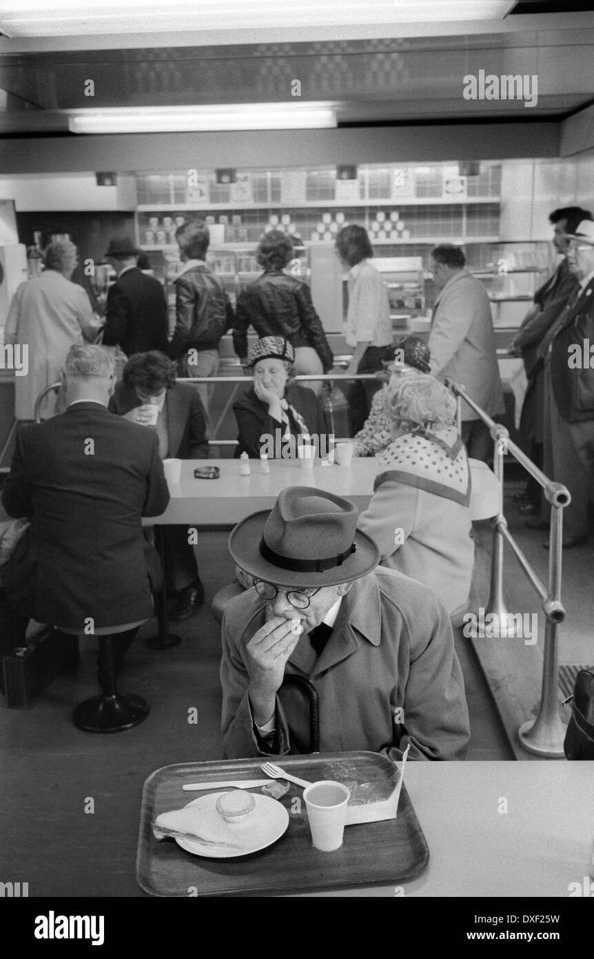 1970s resturant train station. Older senior man eating his cafe lunch ...