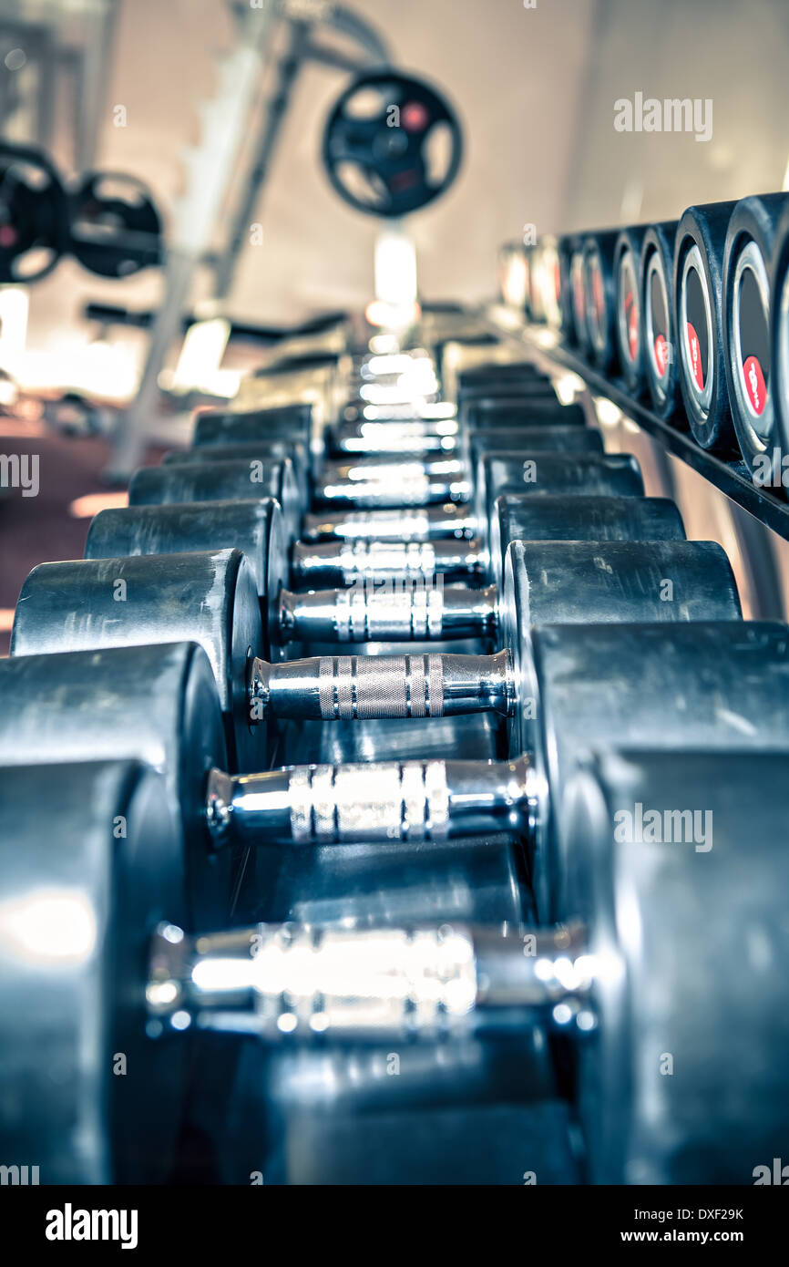 diverse equipment and machines at the gym room Stock Photo - Alamy