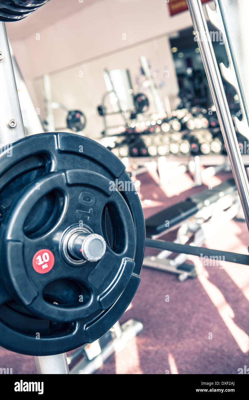 diverse equipment and machines at the gym room Stock Photo - Alamy