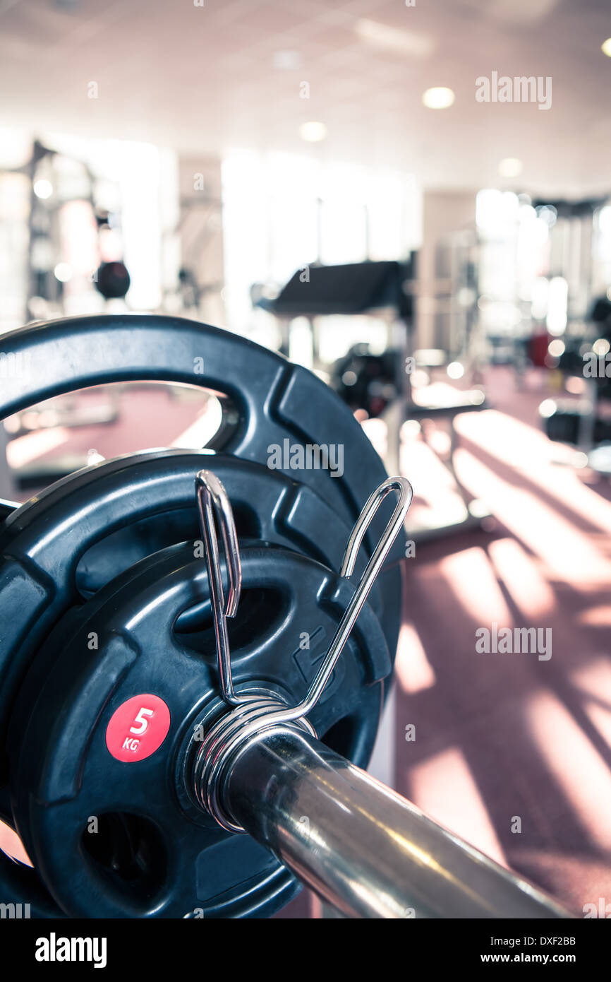 diverse equipment and machines at the gym room Stock Photo - Alamy