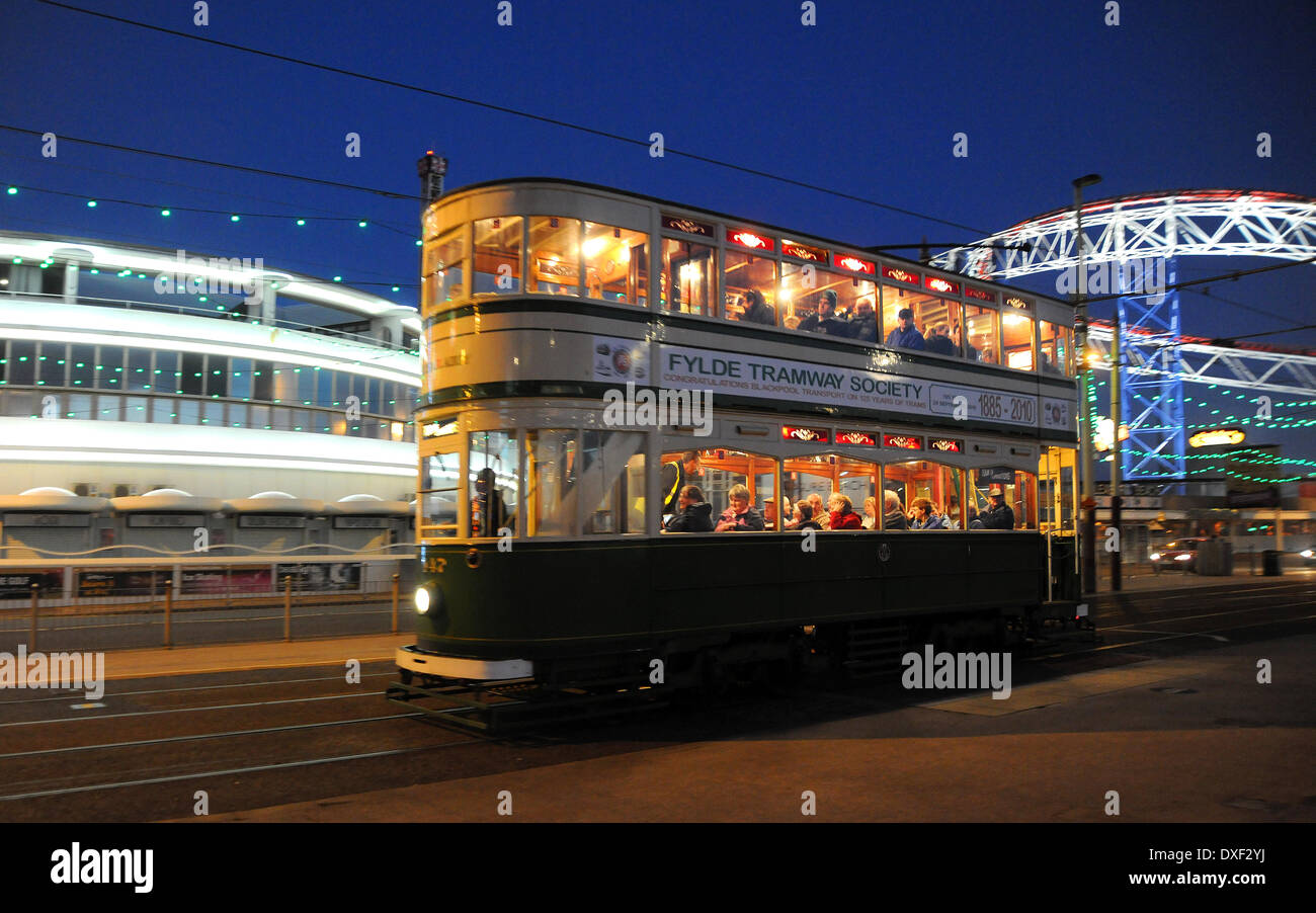 vintage tram passes the pleasure beach on blackpool promenade during ...