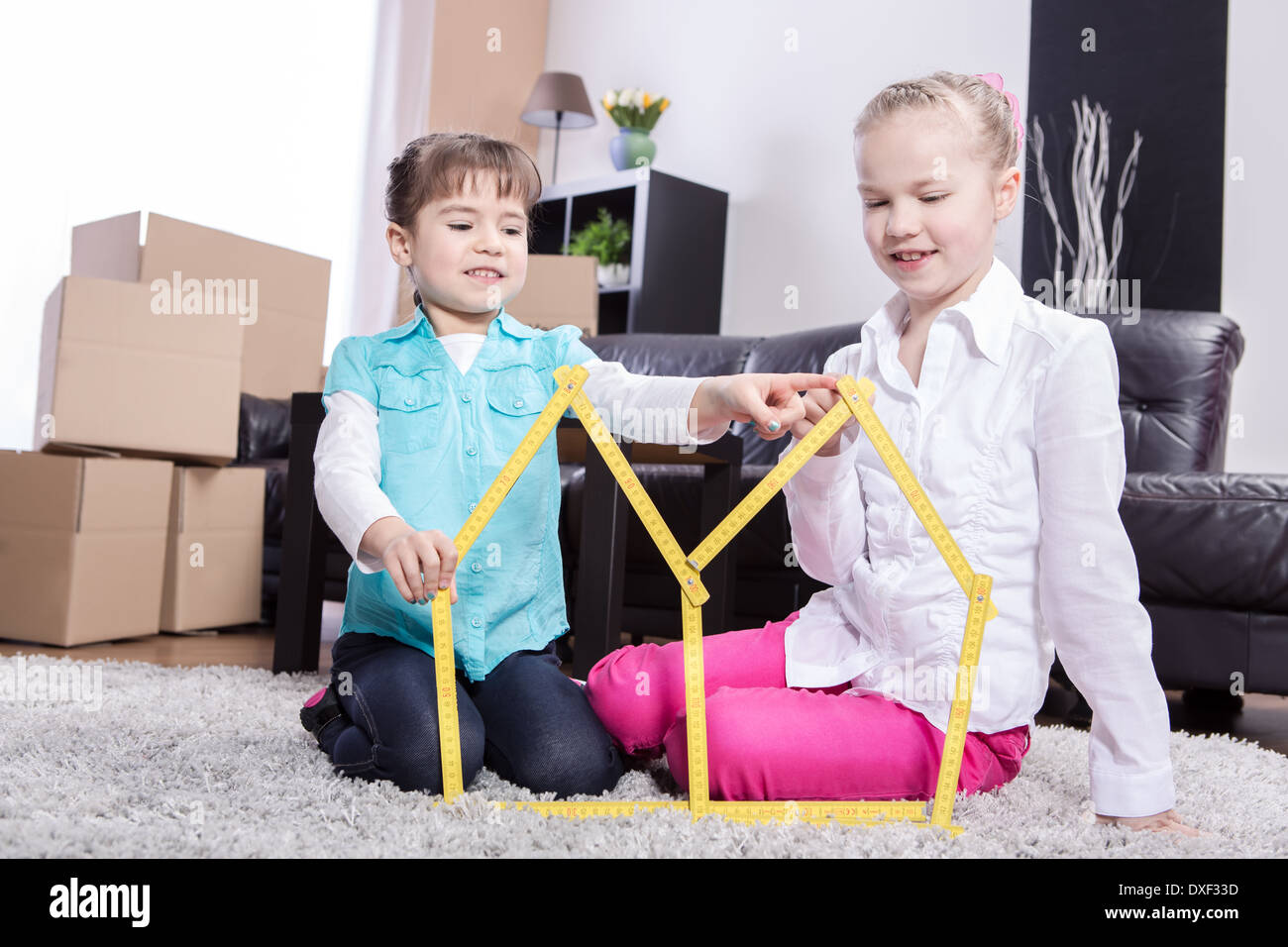 two young girls inside of their new home Stock Photo - Alamy