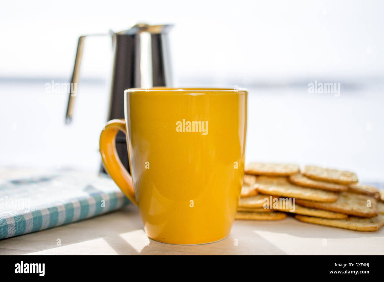 A cup of coffee, espresso maker and crackers in a landscape Stock Photo ...