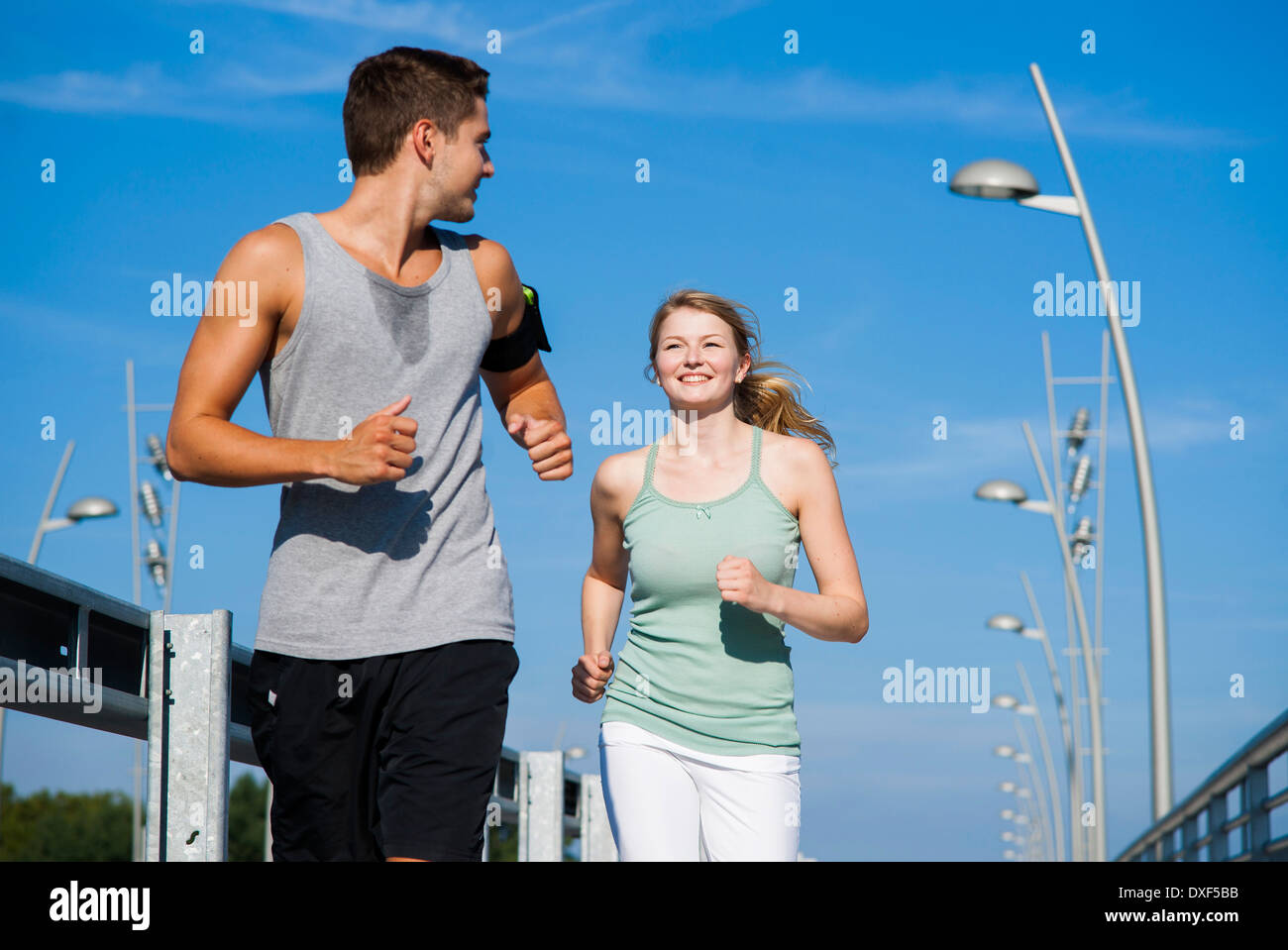 Man looking over shoulder running hi-res stock photography and images ...
